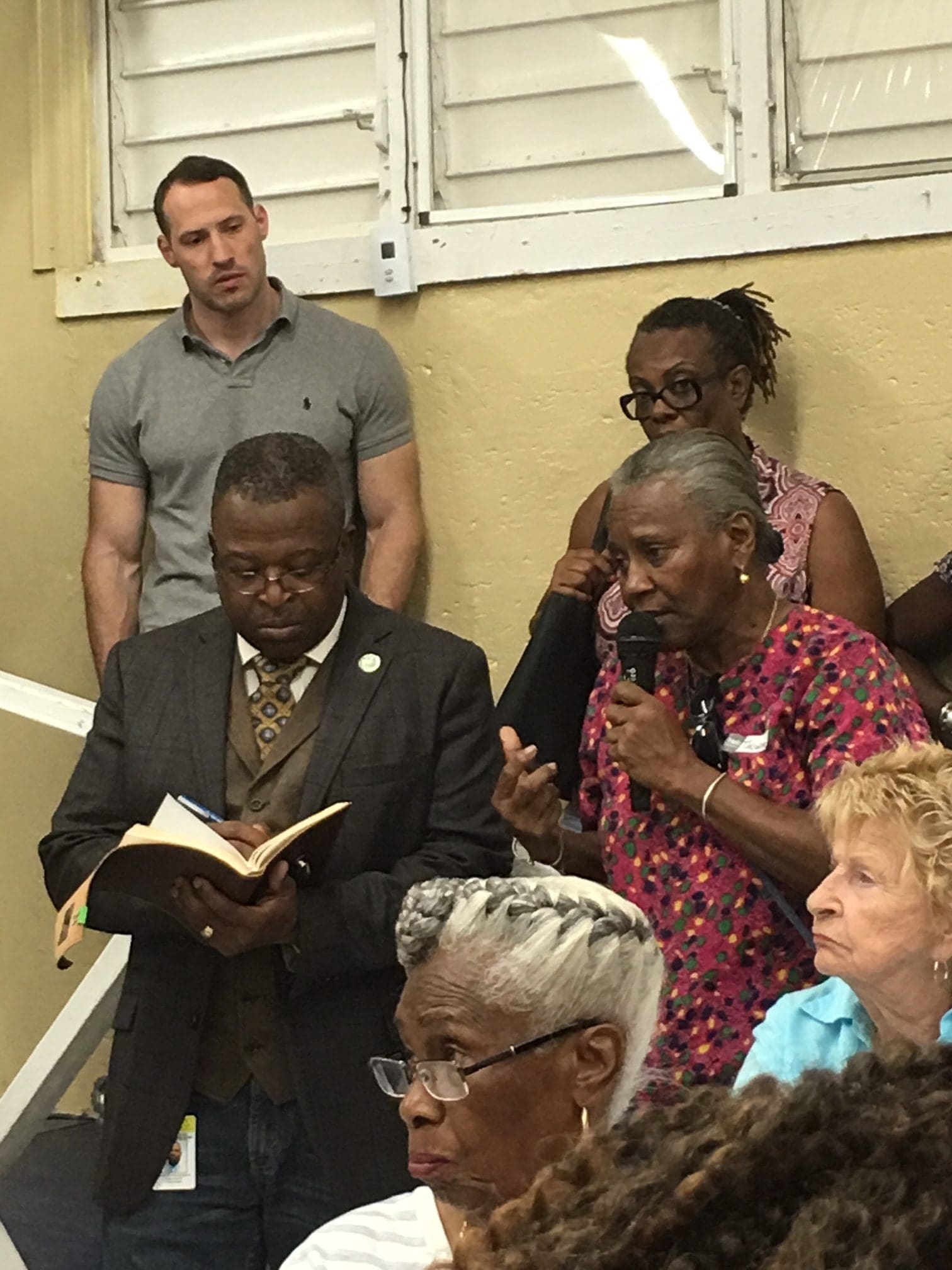 Eugene Farrell takes notes while Theodora Moorehead makes a point | St ...